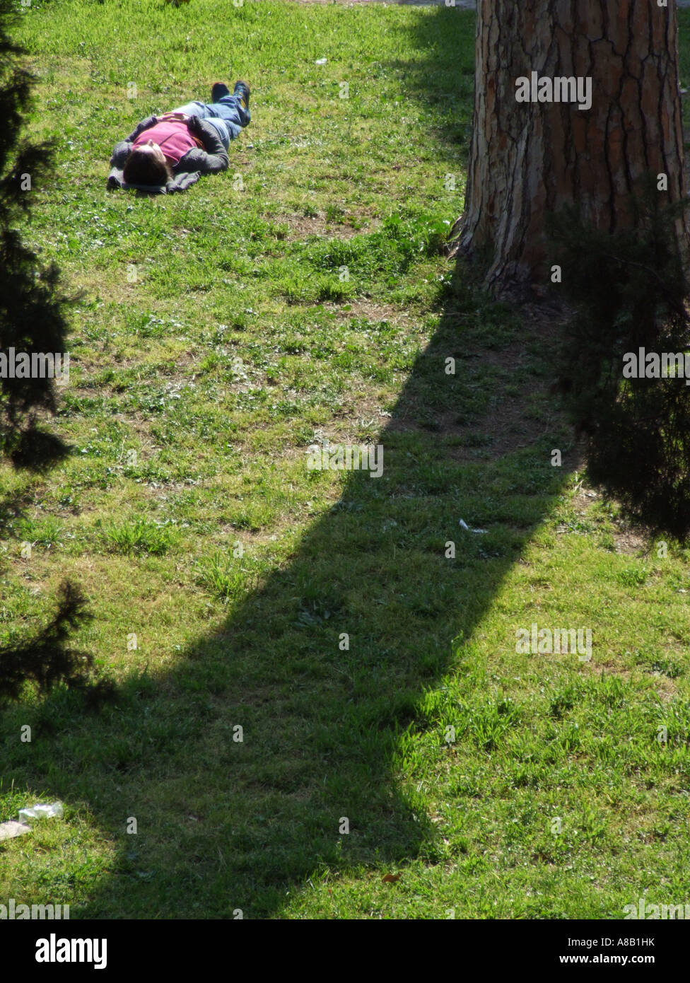 people sleeping in park in rome Stock Photo - Alamy