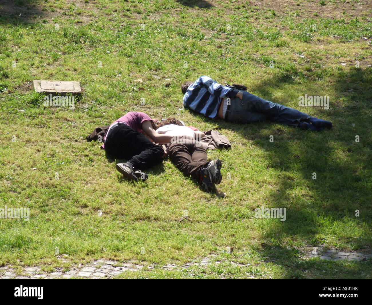 people sleeping in park in rome Stock Photo - Alamy
