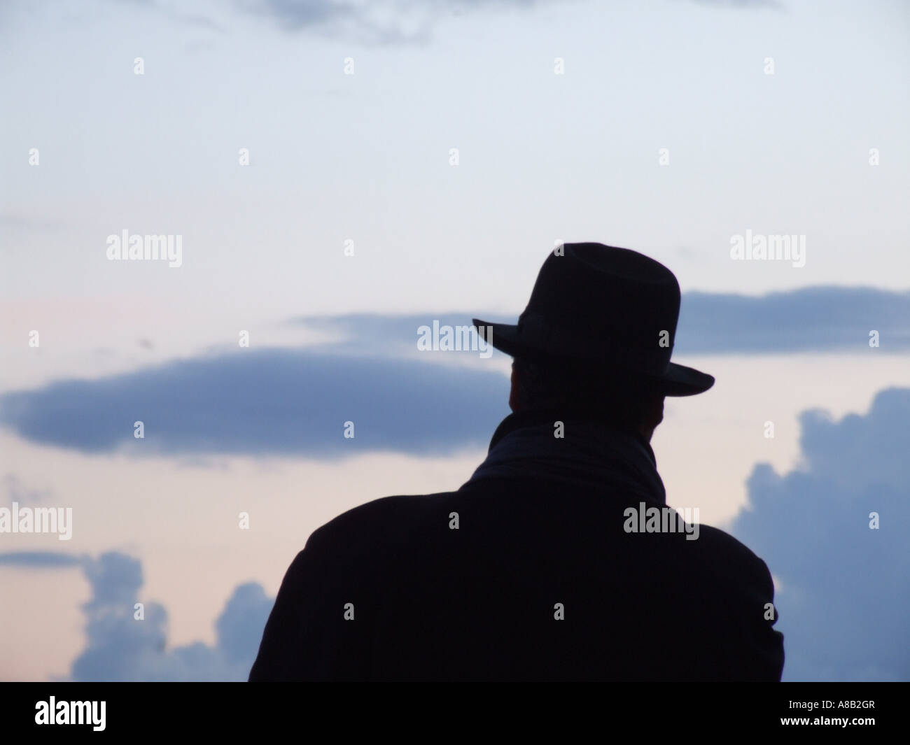 backlit man against dramatic sky Stock Photo - Alamy