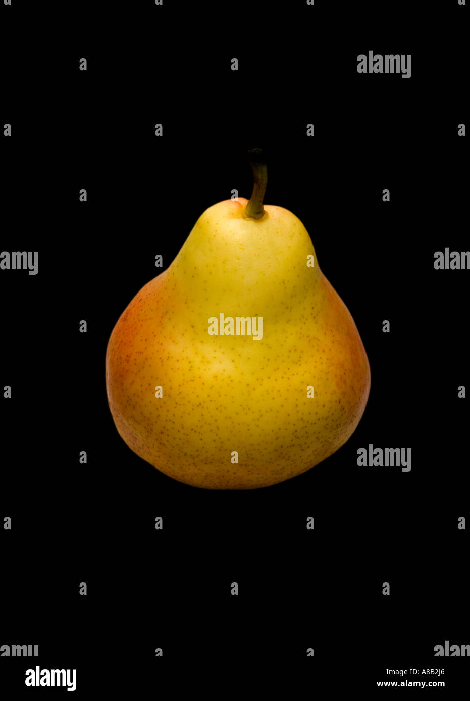 Single pear shot against a black background Stock Photo - Alamy