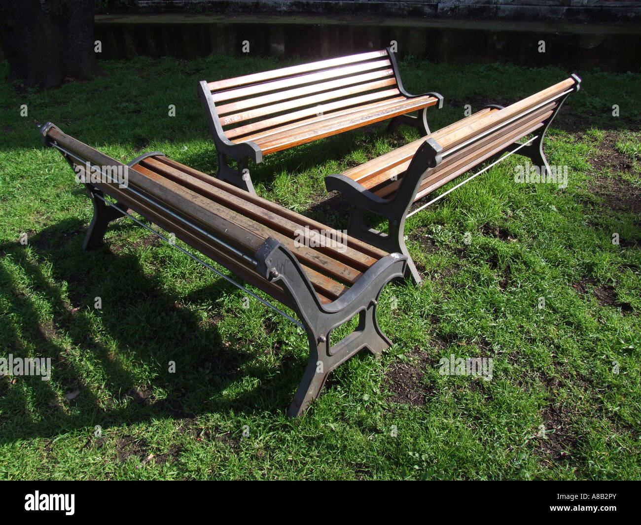 three benches in park Stock Photo - Alamy