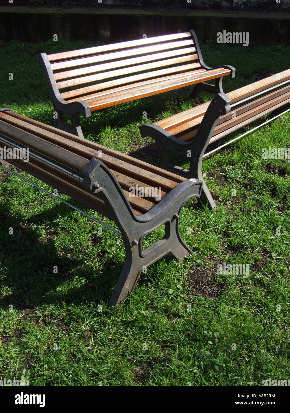 three benches in park Stock Photo - Alamy