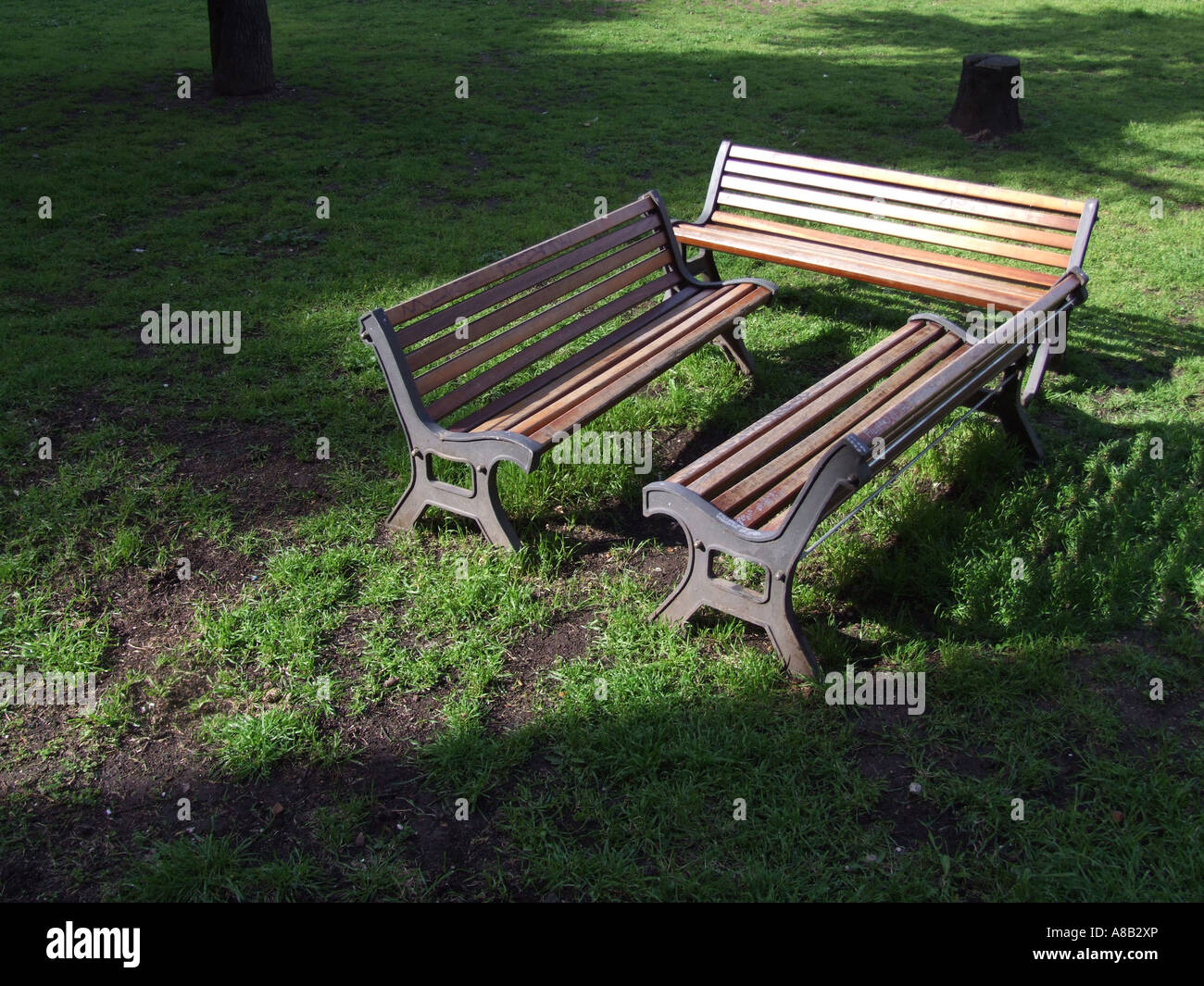 three benches in park Stock Photo - Alamy