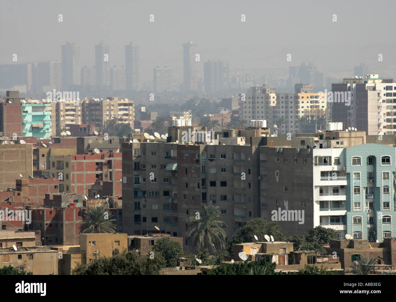 Suburban cityscape with hazy view of skyscraper skyline in distance ...
