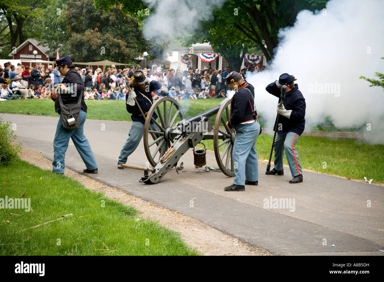 soldiers exploding canon during the reenactment of a civil war battle ...