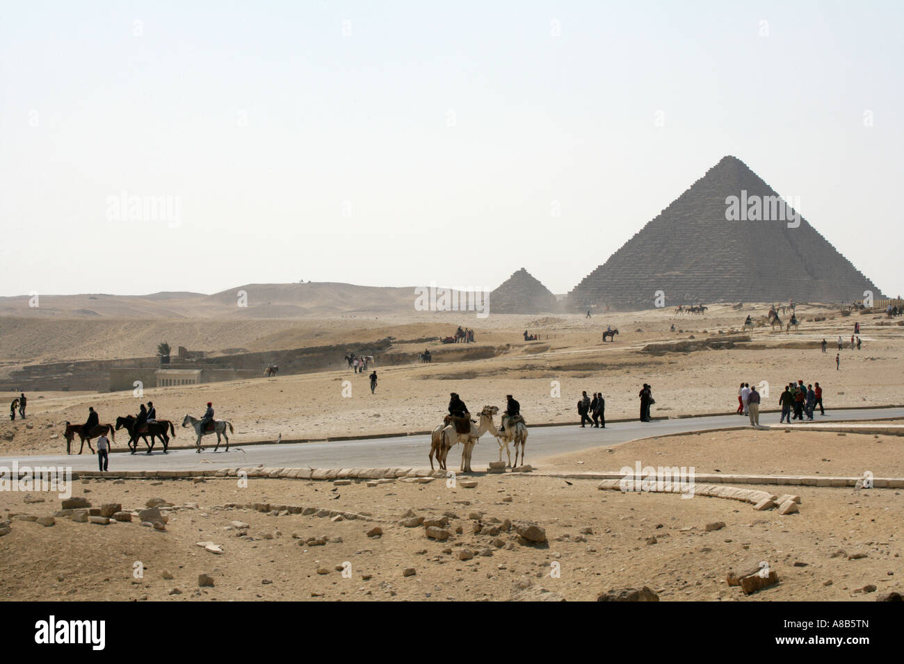 Landscape with tourists visiting pyramids, Giza, Cairo, Egypt, Middle ...