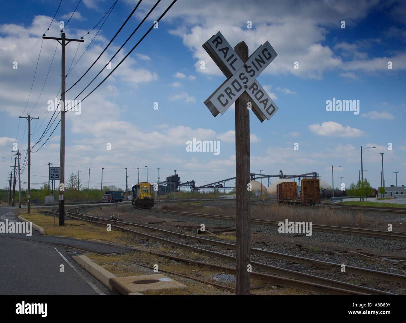 Railroad crossing sign near railroad tracks Stock Photo - Alamy