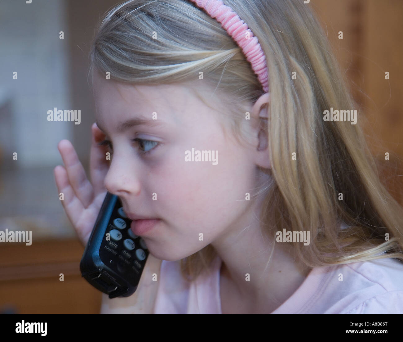 Child listening on a telephone Stock Photo - Alamy