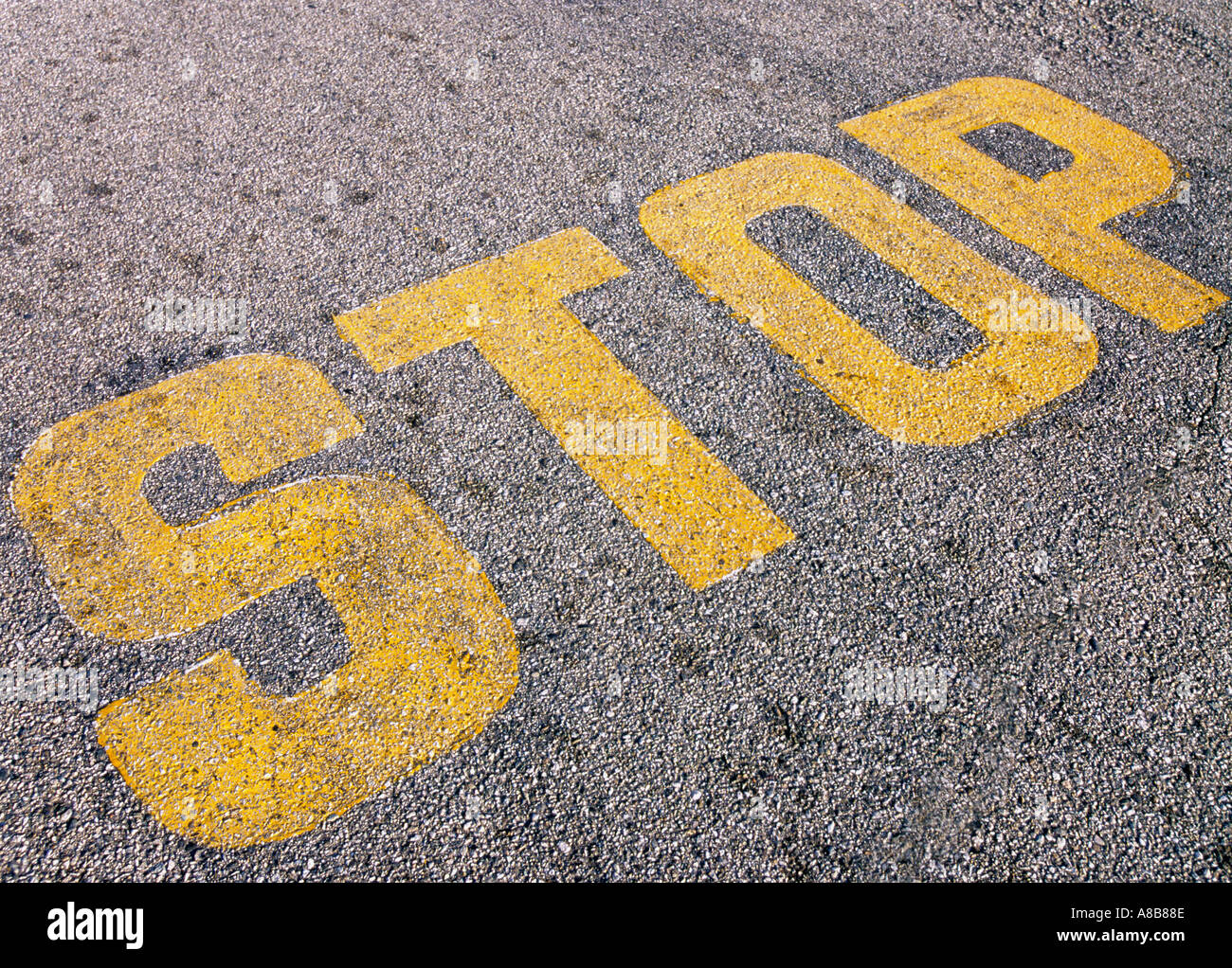 Stop sign on Road Stock Photo - Alamy