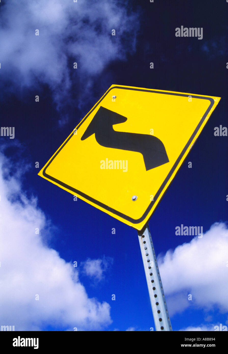 Winding Road warning sign Stock Photo - Alamy