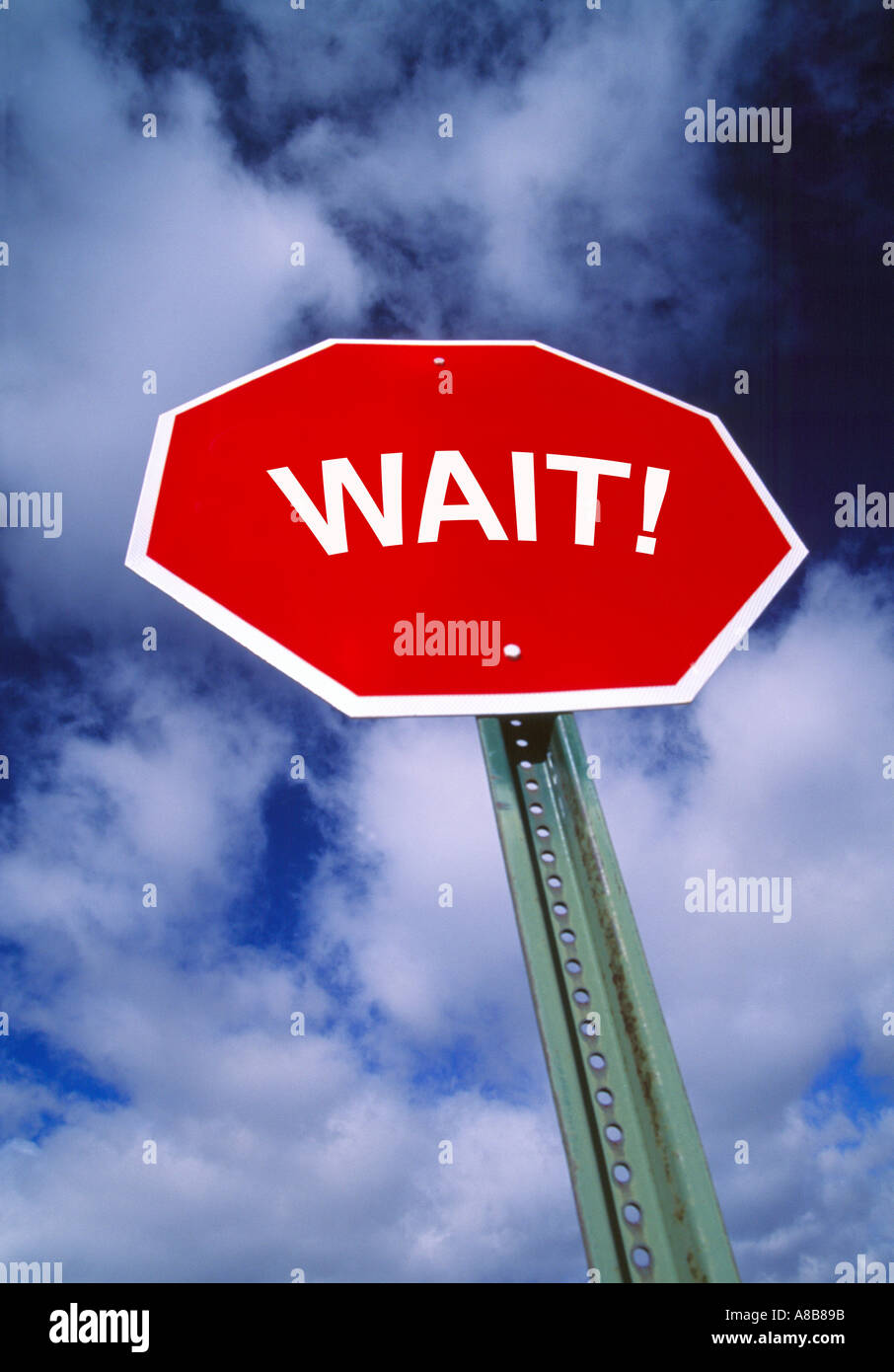 Wait on a Raod Sign Stock Photo - Alamy