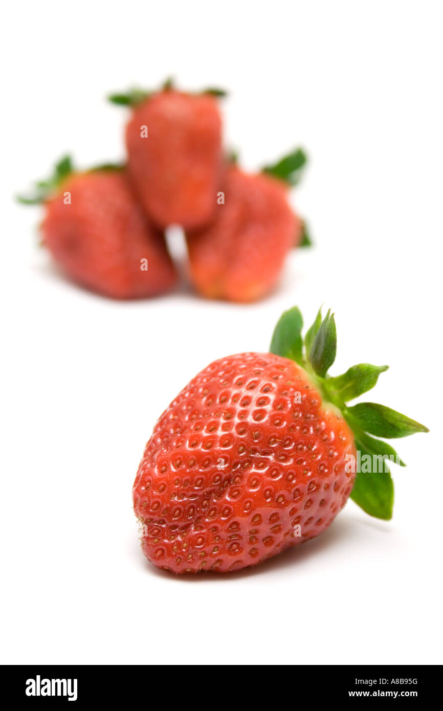 Bunch of Strawberries Front one focused Isolated on a white background ...
