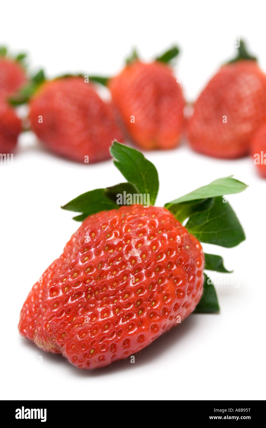 Bunch of Strawberries Front one focused Isolated on a white background ...