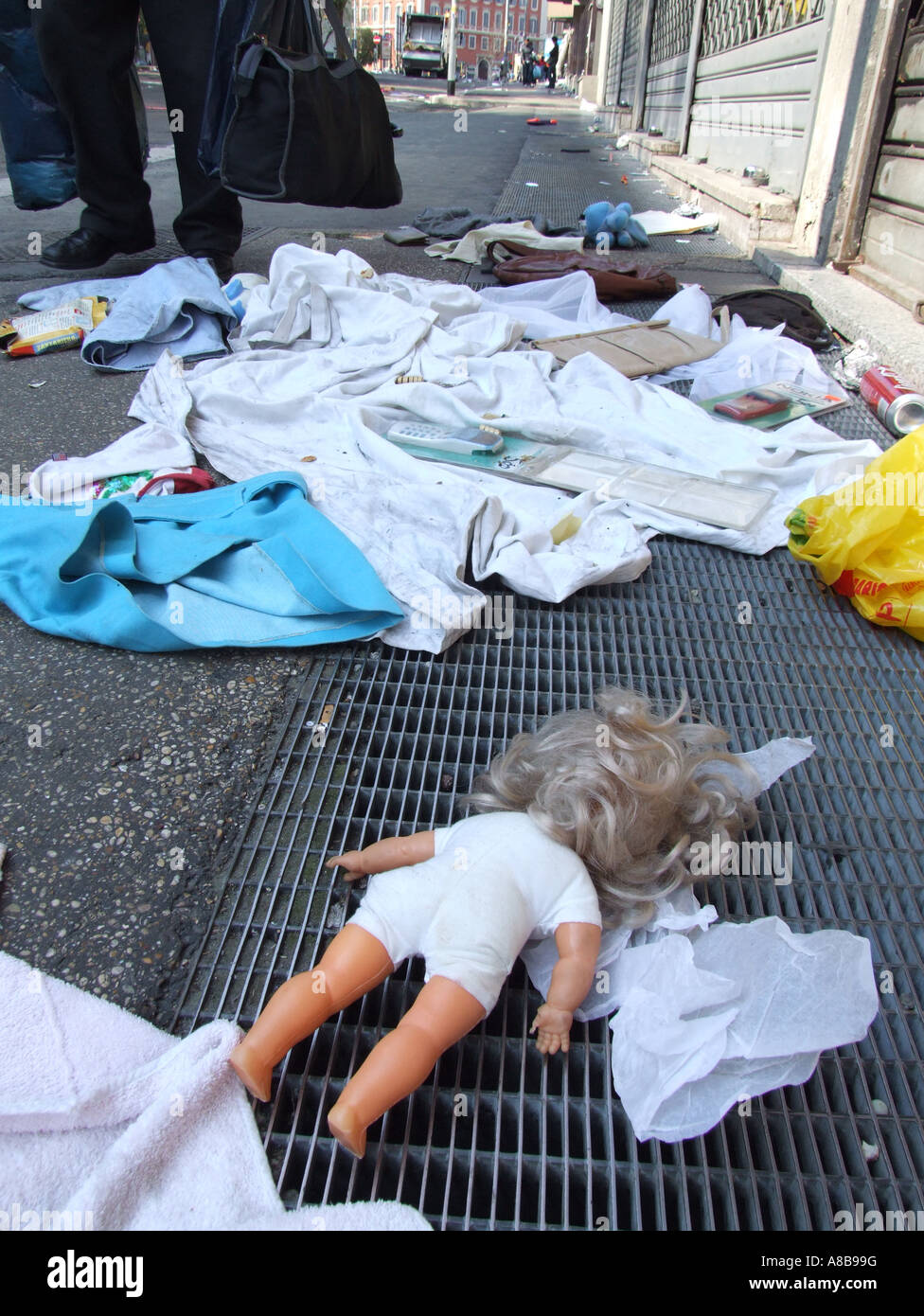 baby doll discarded in street Stock Photo - Alamy