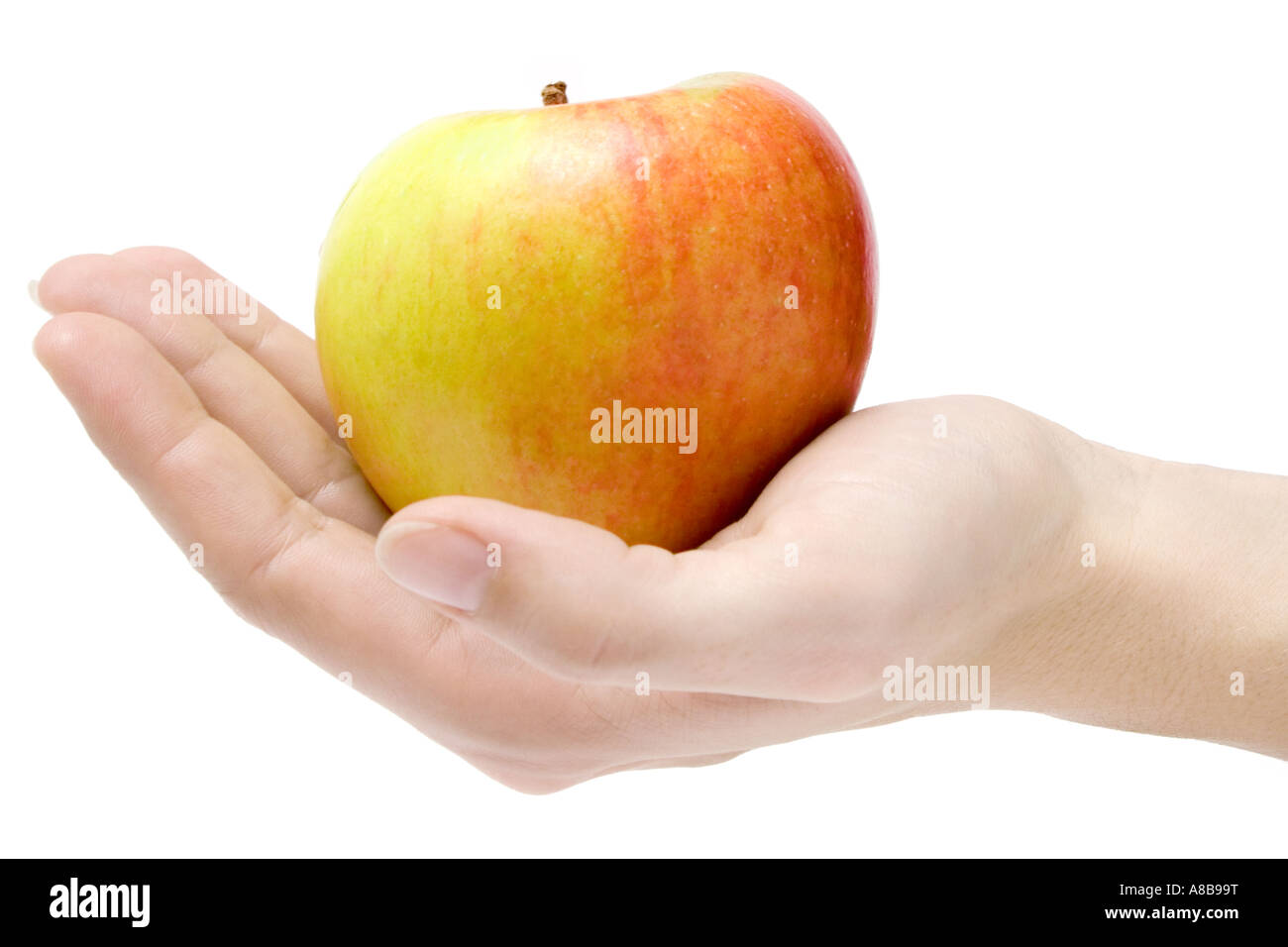 Female hand presenting a colorful apple Isolated on a white background ...