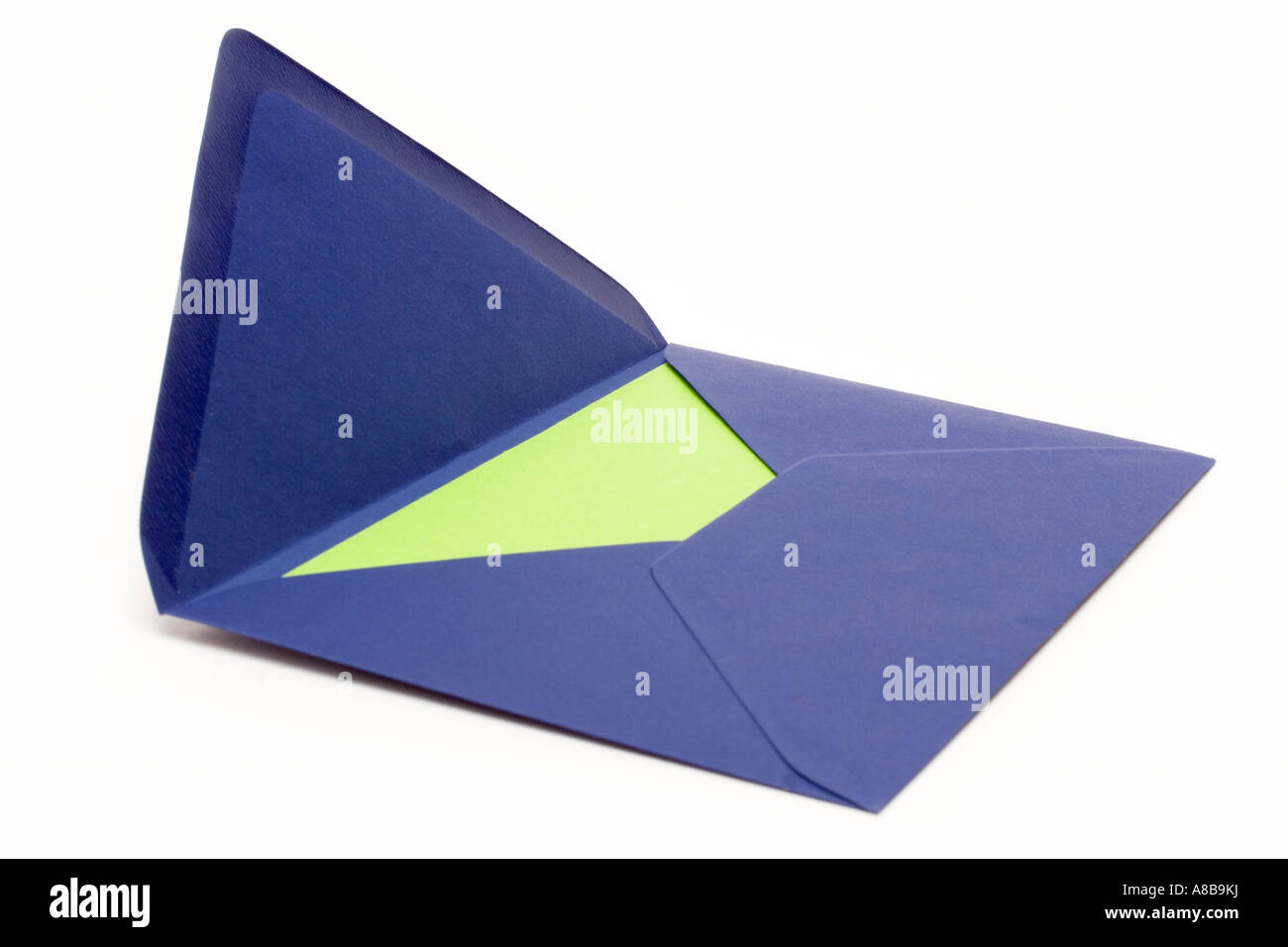 Greenish paper in an open blue envelope Isolated on a white background ...