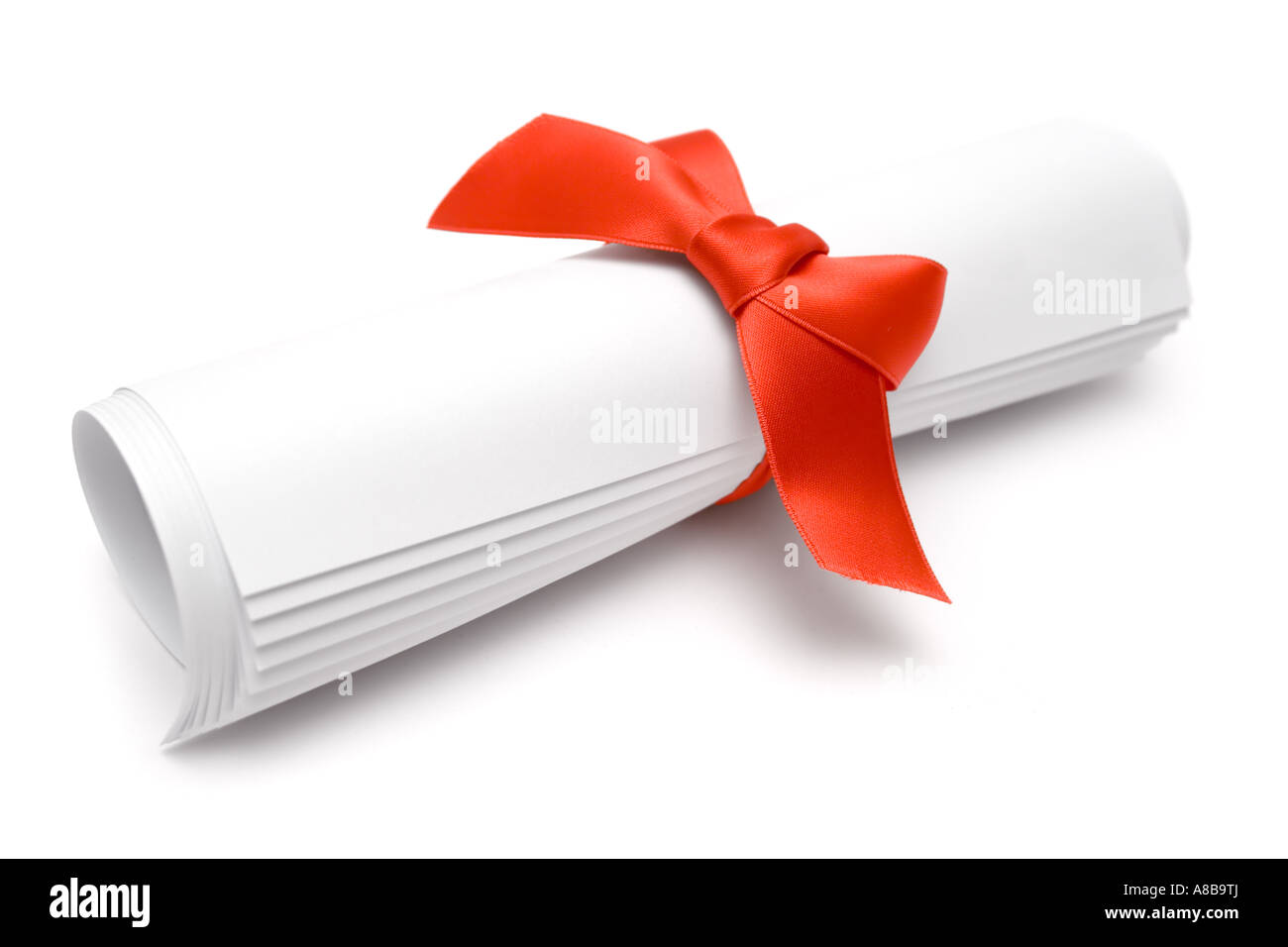 Rolled certificate with a red ribbon isolated on a white background ...