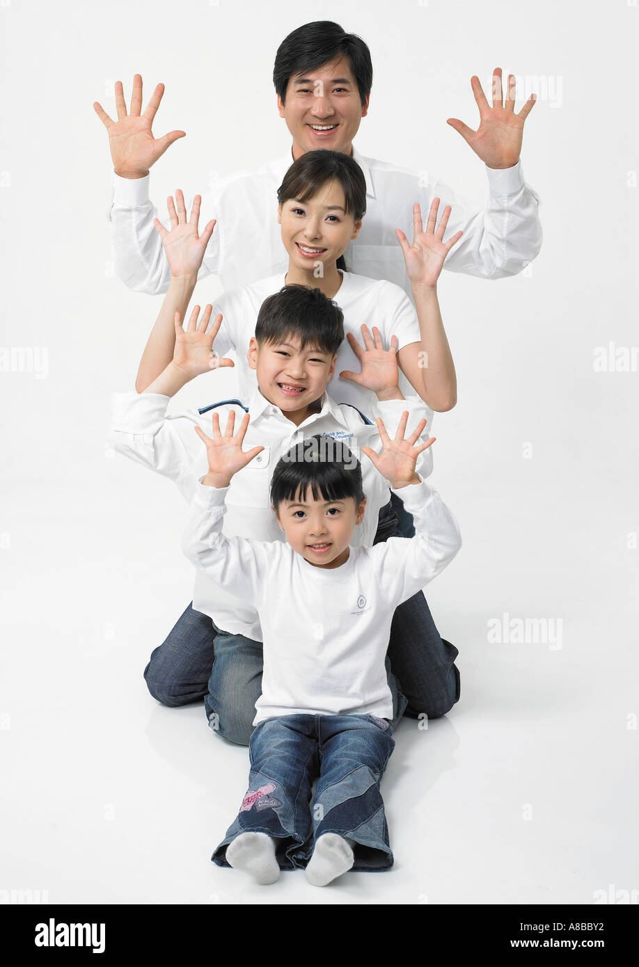 family members are sitting in a row Stock Photo - Alamy