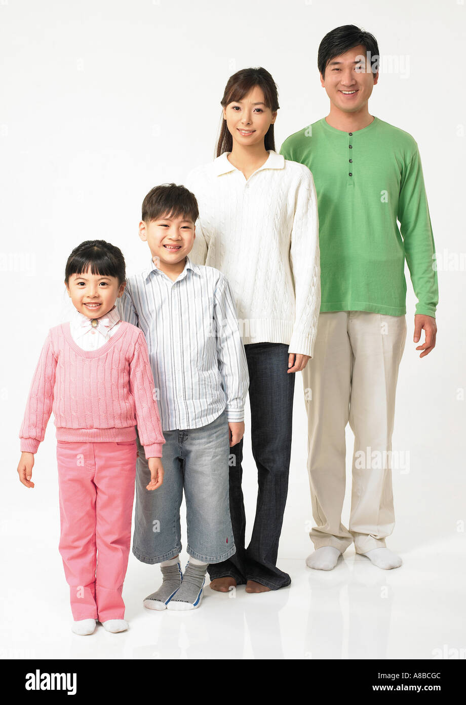 family members stood in order of height Stock Photo - Alamy