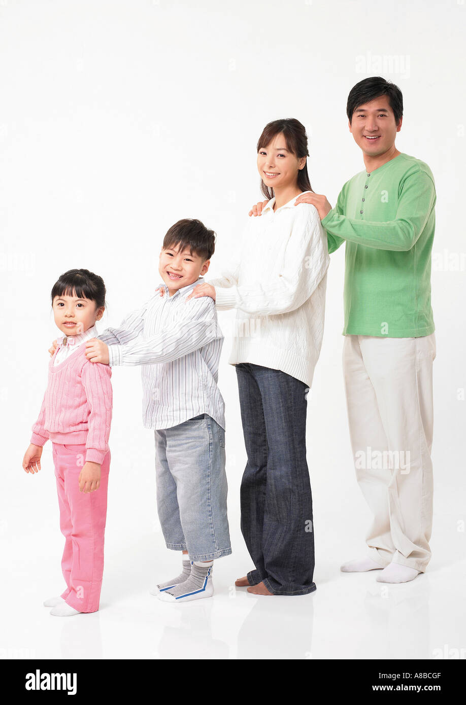 family members stood in order of height Stock Photo - Alamy