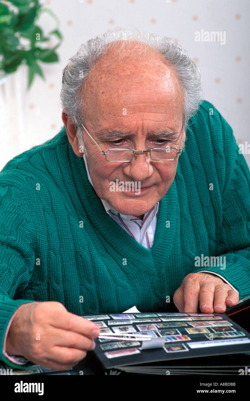 Stamp collector at home hi-res stock photography and images - Alamy