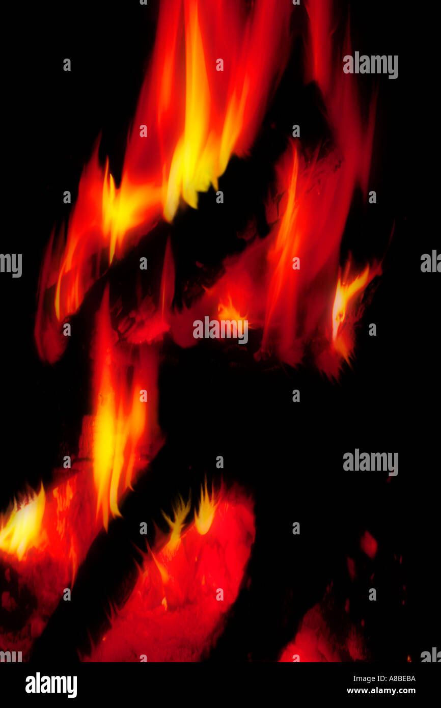 Wood burning on a black background Stock Photo - Alamy