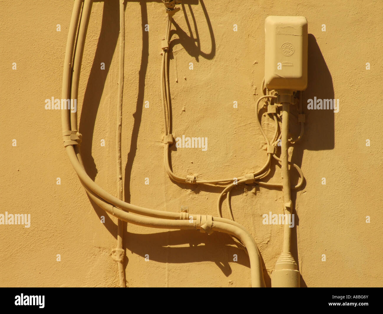 tangled wiring connections on property wall Stock Photo - Alamy