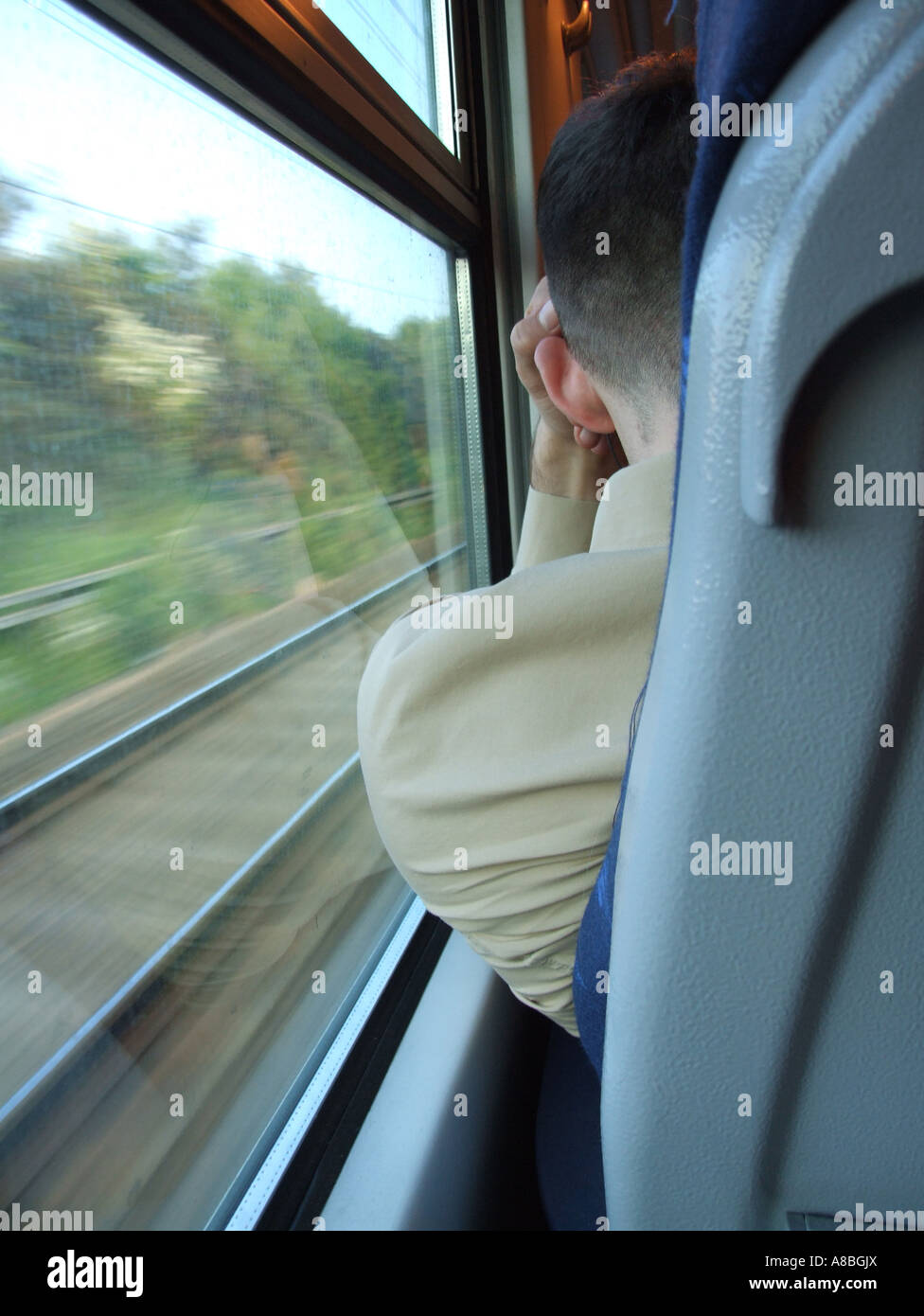 commuter sitting in train Stock Photo - Alamy