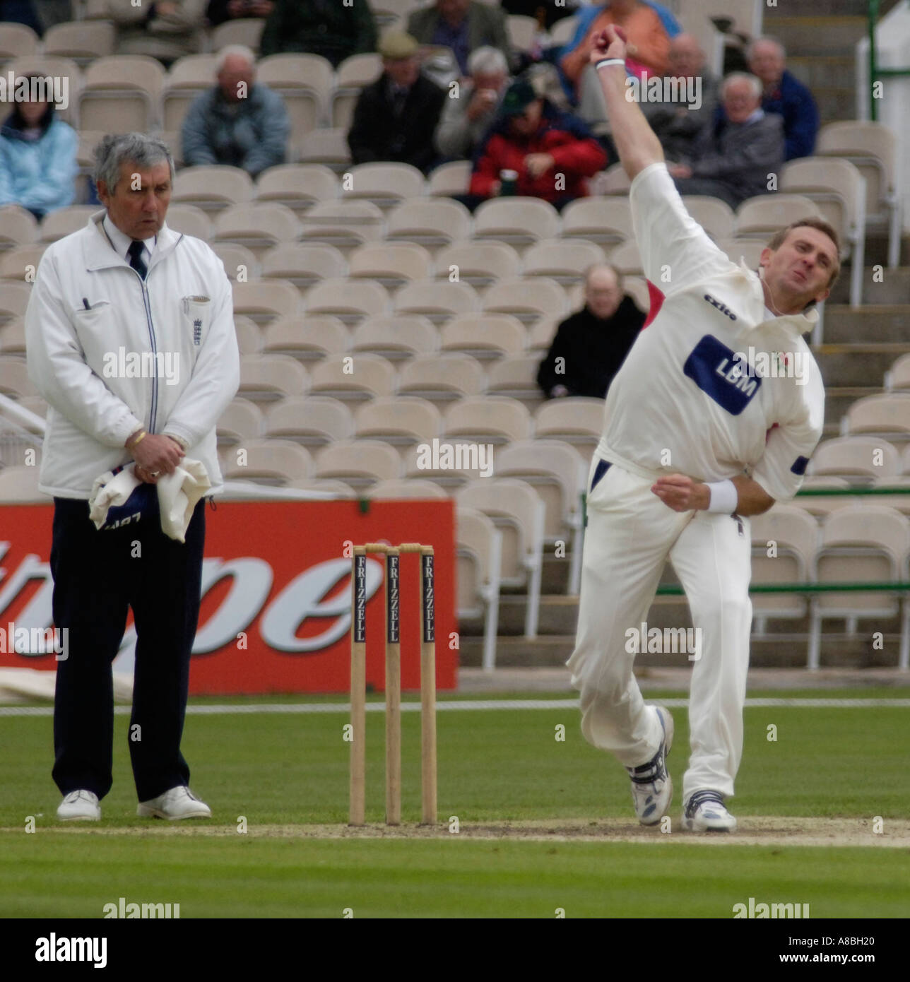 Dominic Cork bowling for lancashire at old trafford Stock Photo - Alamy