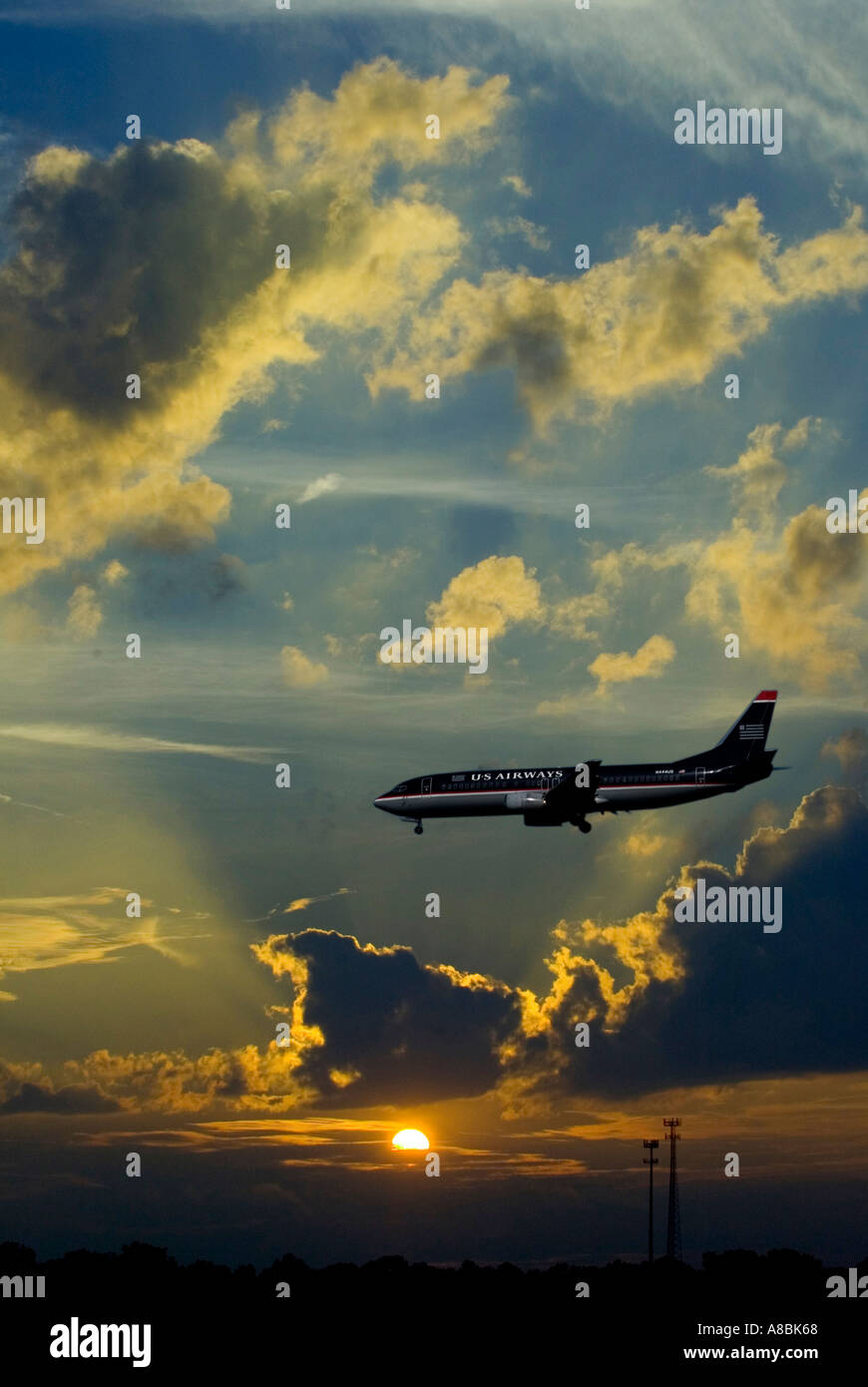 Red Sunset with jet airliner aircraft landing Stock Photo - Alamy