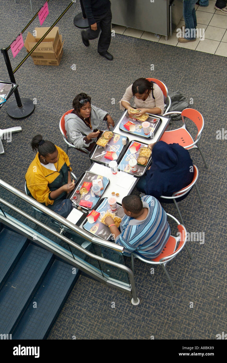 Middle school students eat at a fast food restaurant in Washington DC ...