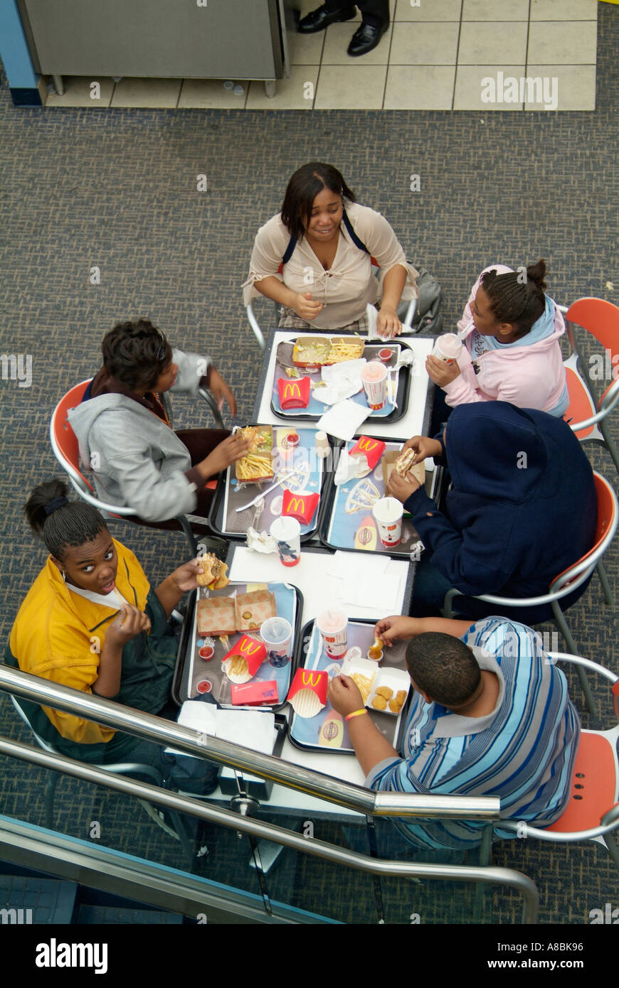 Middle school students eat at a fast food restaurant in Washington DC ...