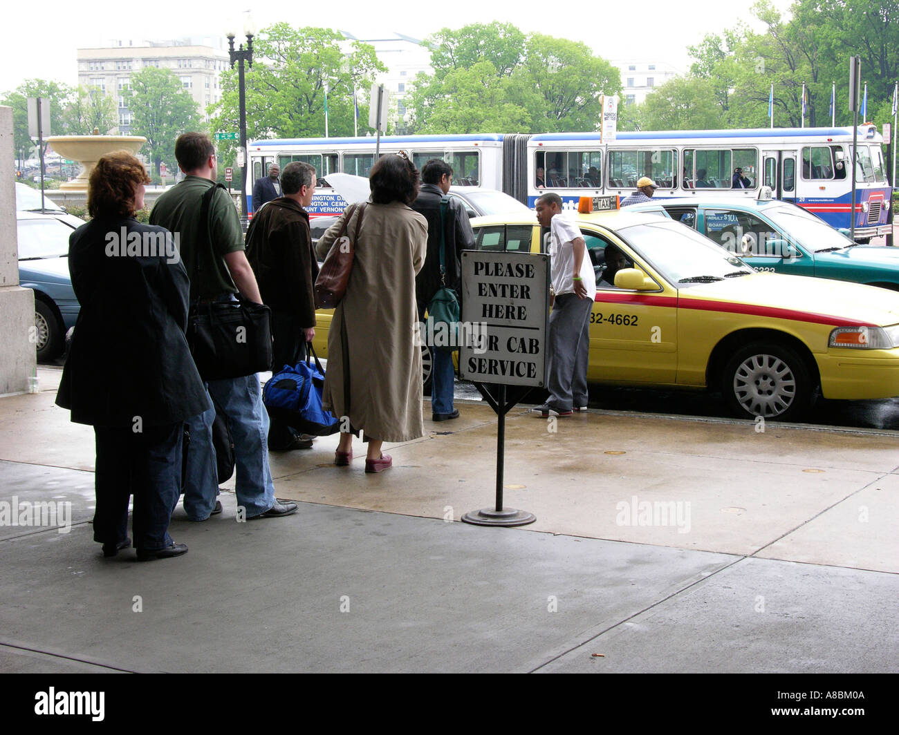 People line up to catch taxi cab at the Union Station in Washington DC ...