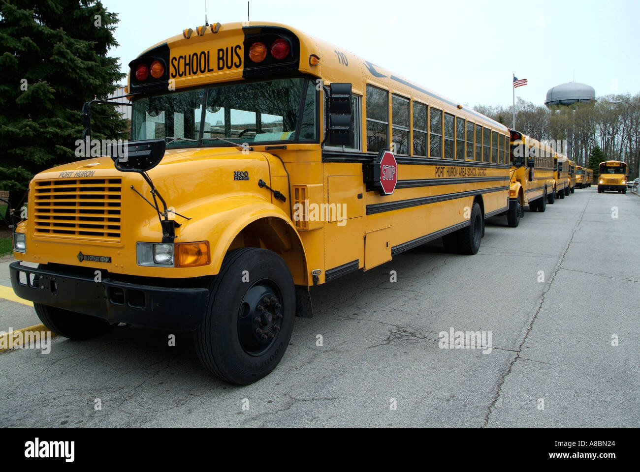 School busses lined up in front of middle school ready to transport ...