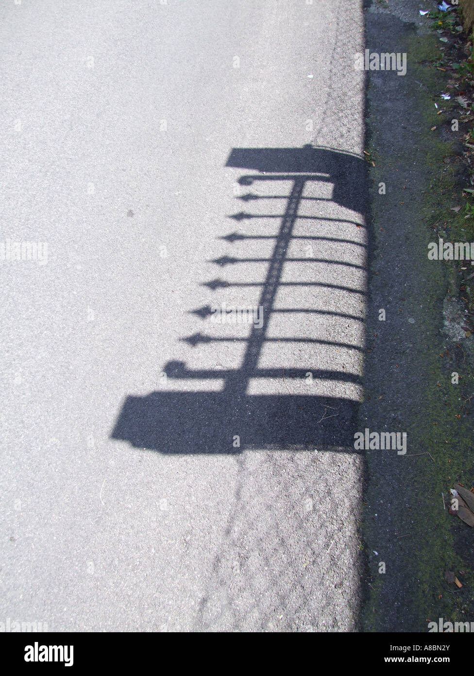 gate shadow on street Stock Photo - Alamy