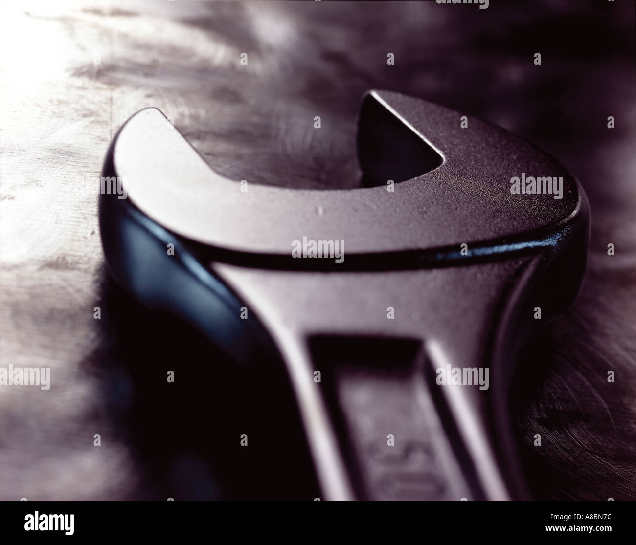 spanner on scratched metal background Stock Photo - Alamy