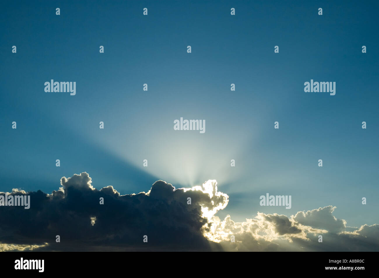 Sun Rays emerging from behind Clouds God Beams Africa Stock Photo - Alamy