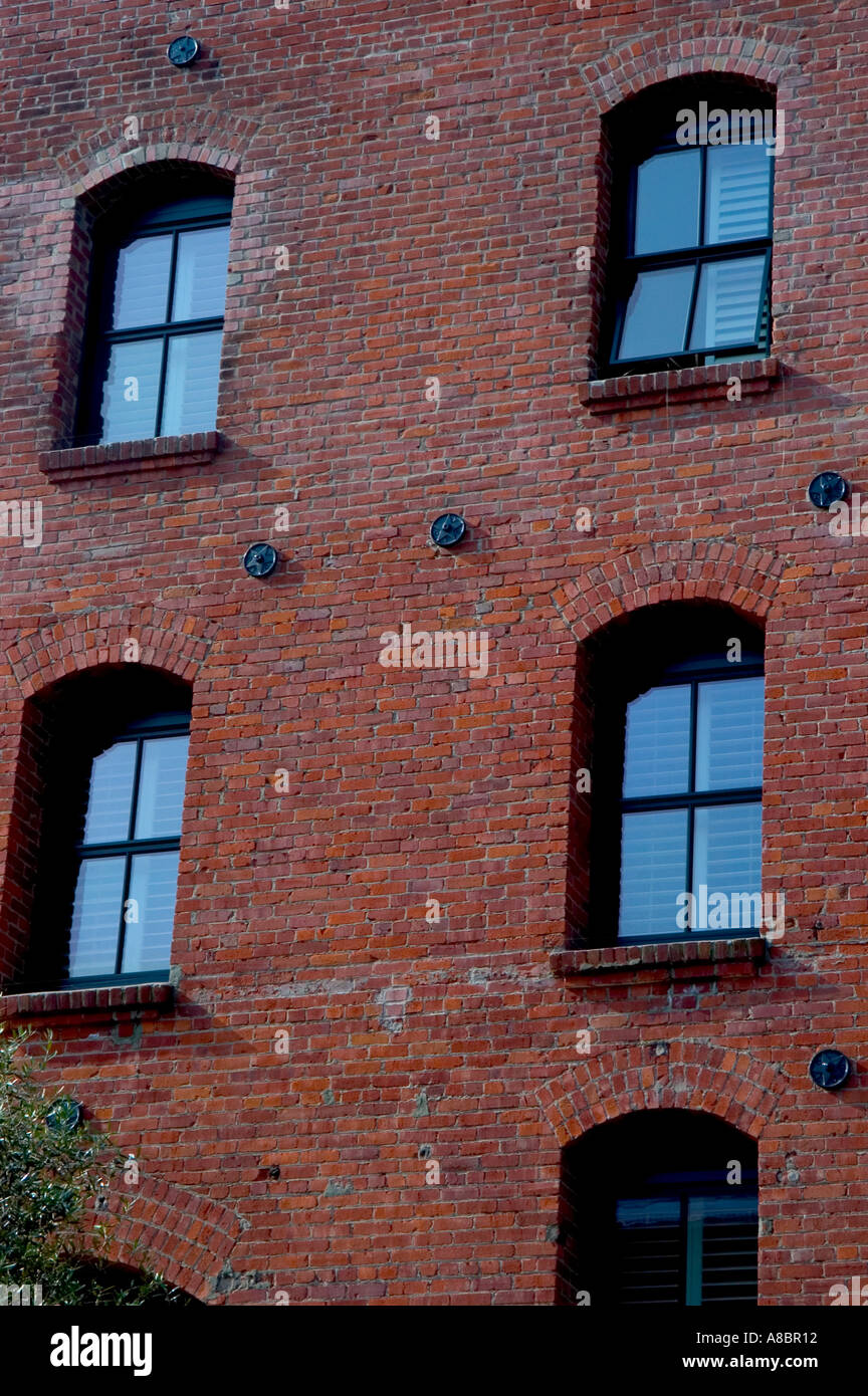 Arched windows in brick wall Stock Photo - Alamy