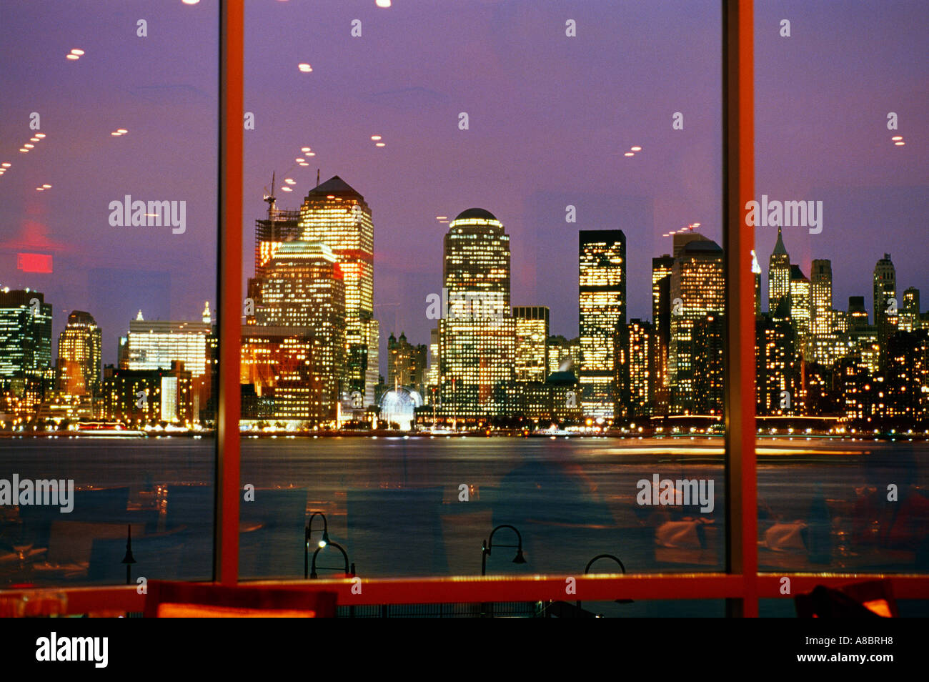 USA New York night scene of Manhattan through the window Stock Photo ...