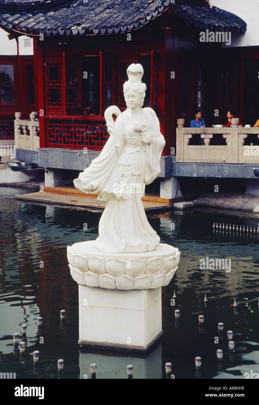 China Shanghai statue of angel in front of lake Stock Photo - Alamy