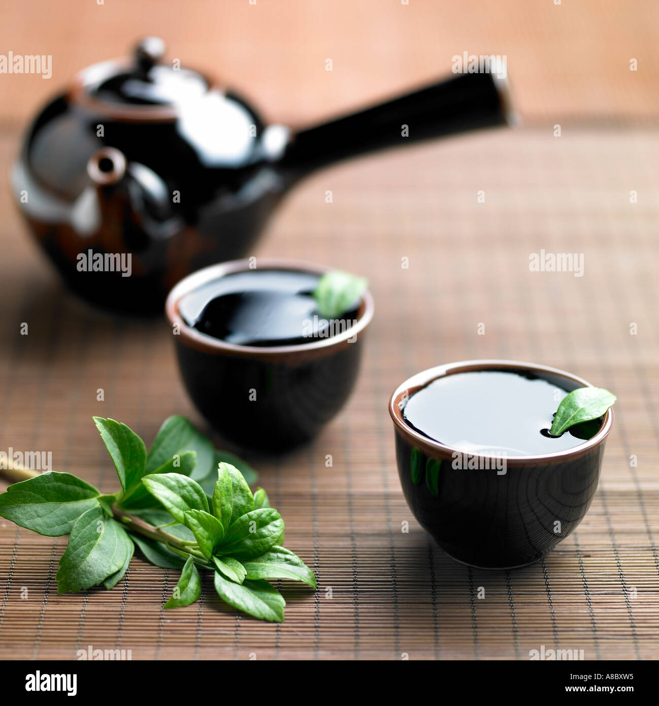 tea leaves floating on the teacup art of tea making Stock Photo - Alamy