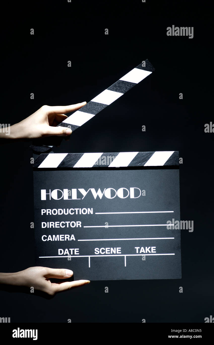 Image a hand with a clapper board Stock Photo - Alamy