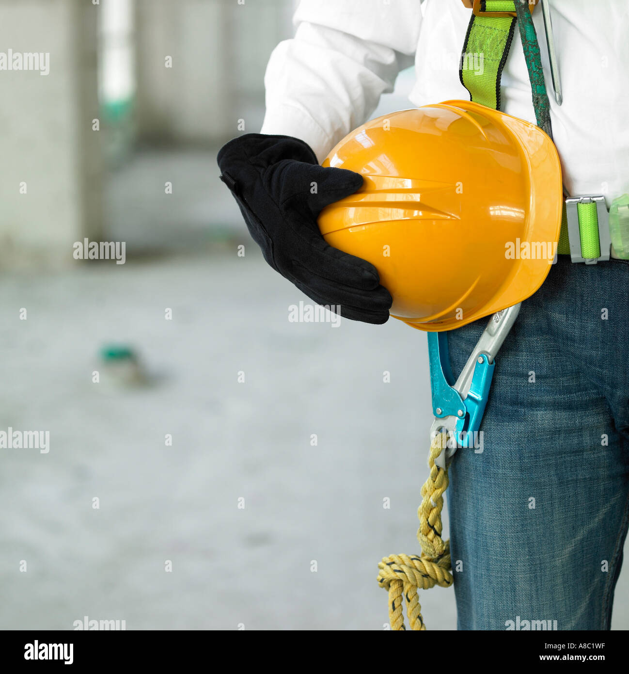 at a construction place a worker s hand holding a safety hand Stock ...