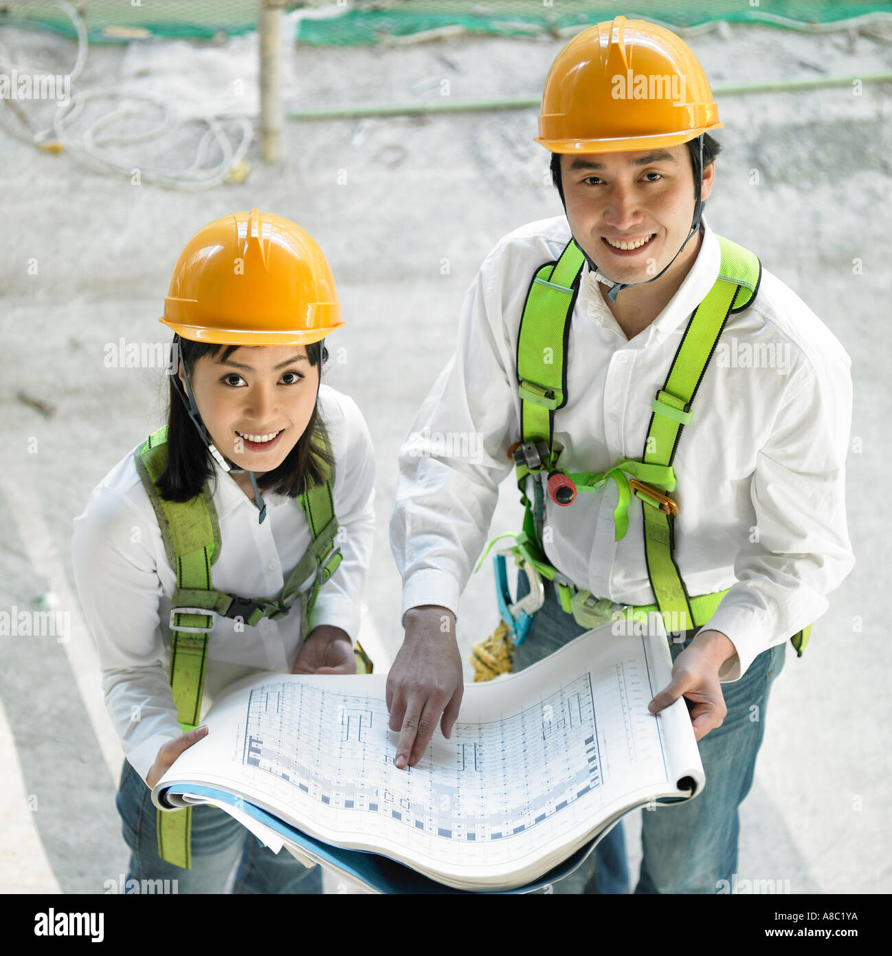 at a construction place architects discussing about a plan Stock Photo ...