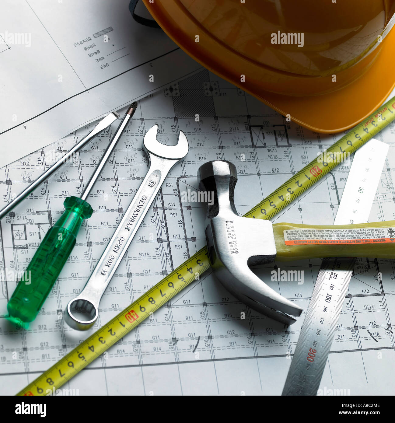 construction a plan and construction tools on a desk Stock Photo - Alamy