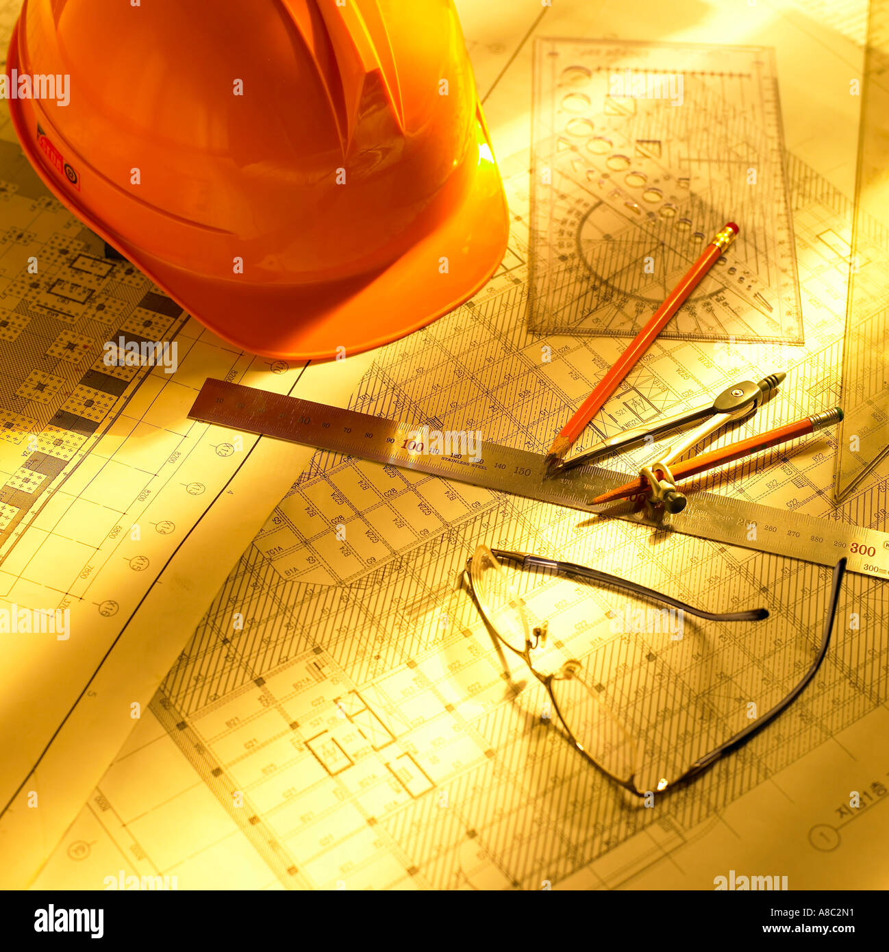 construction a plan and construction tools on a desk Stock Photo - Alamy