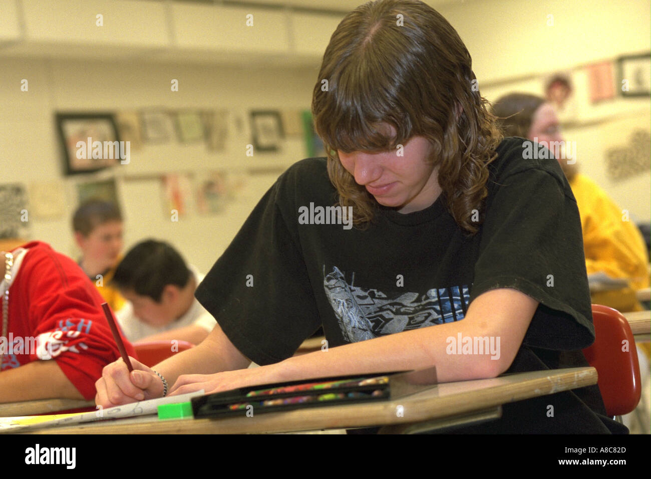 Student age 14 drawing in school art classroom. Golden Valley Minnesota ...