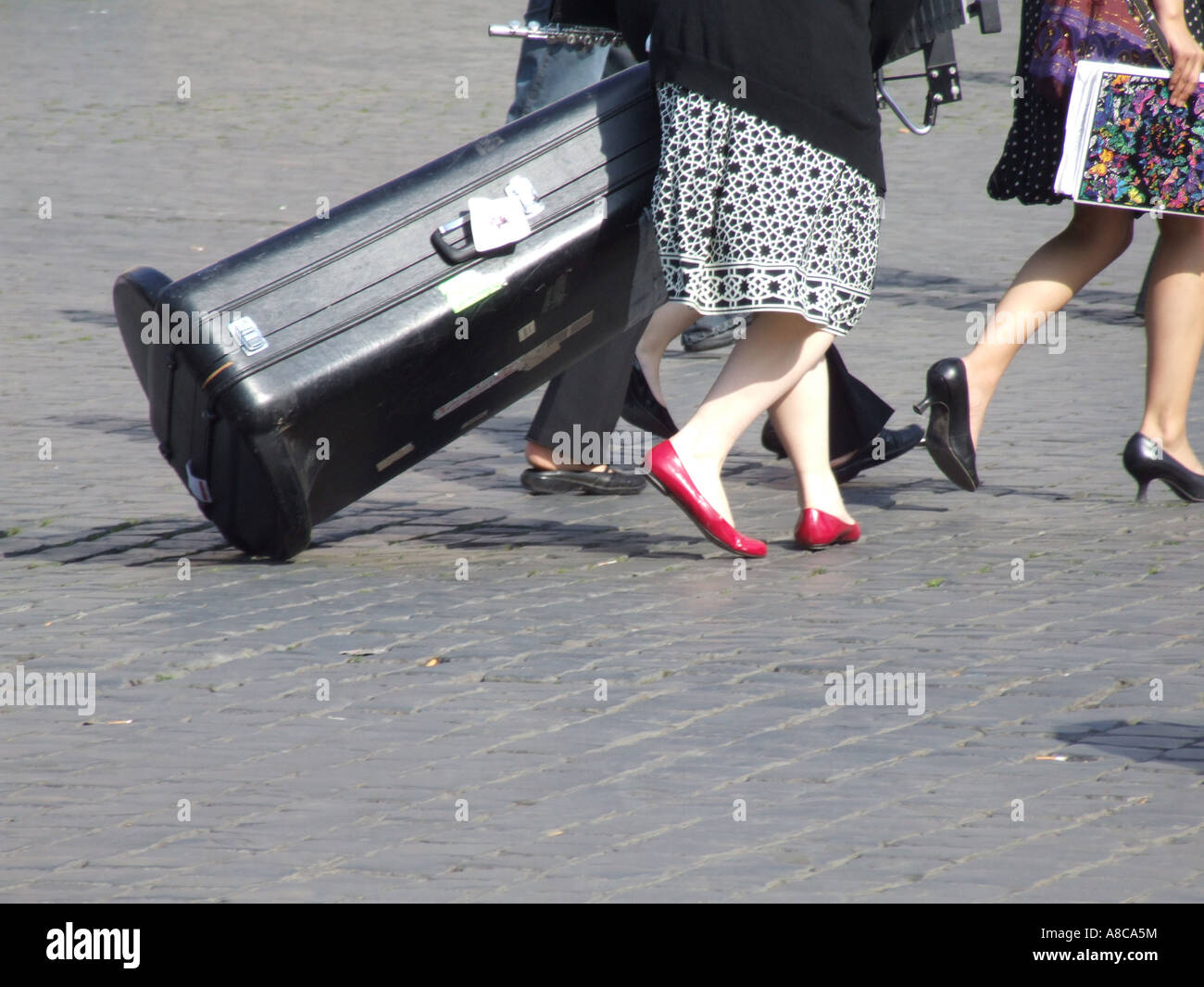 band members carrying instruments Stock Photo - Alamy