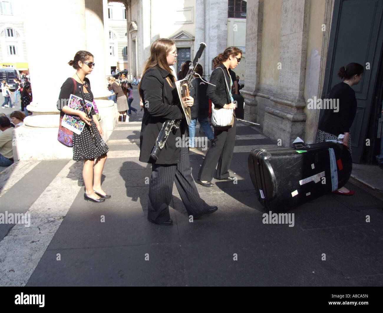 band members carrying instruments in rome italy Stock Photo - Alamy