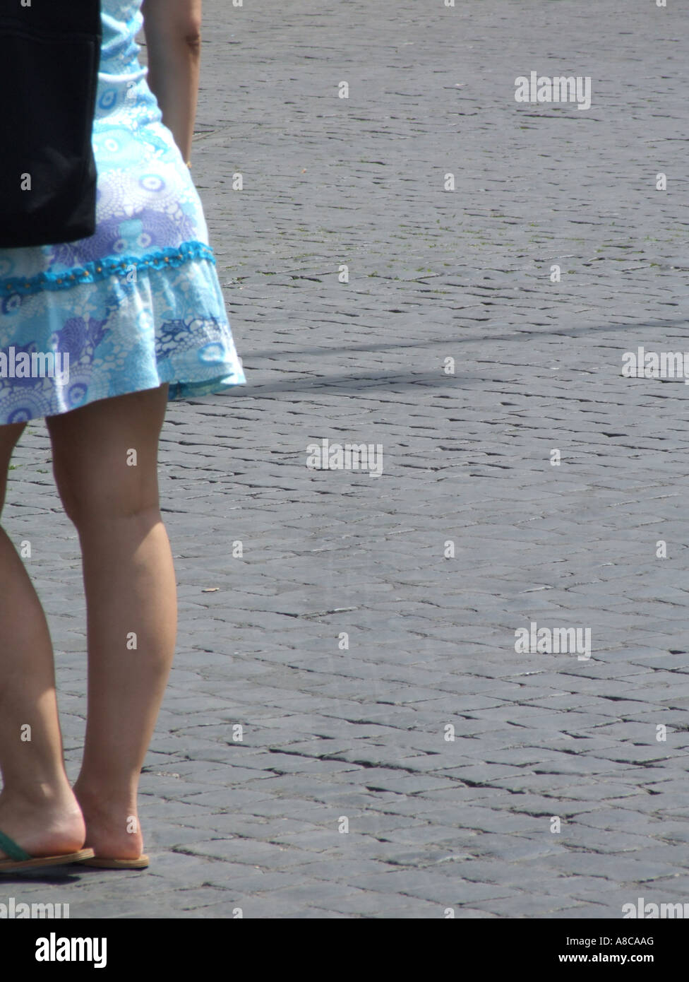 one person walking in street in city town Stock Photo - Alamy